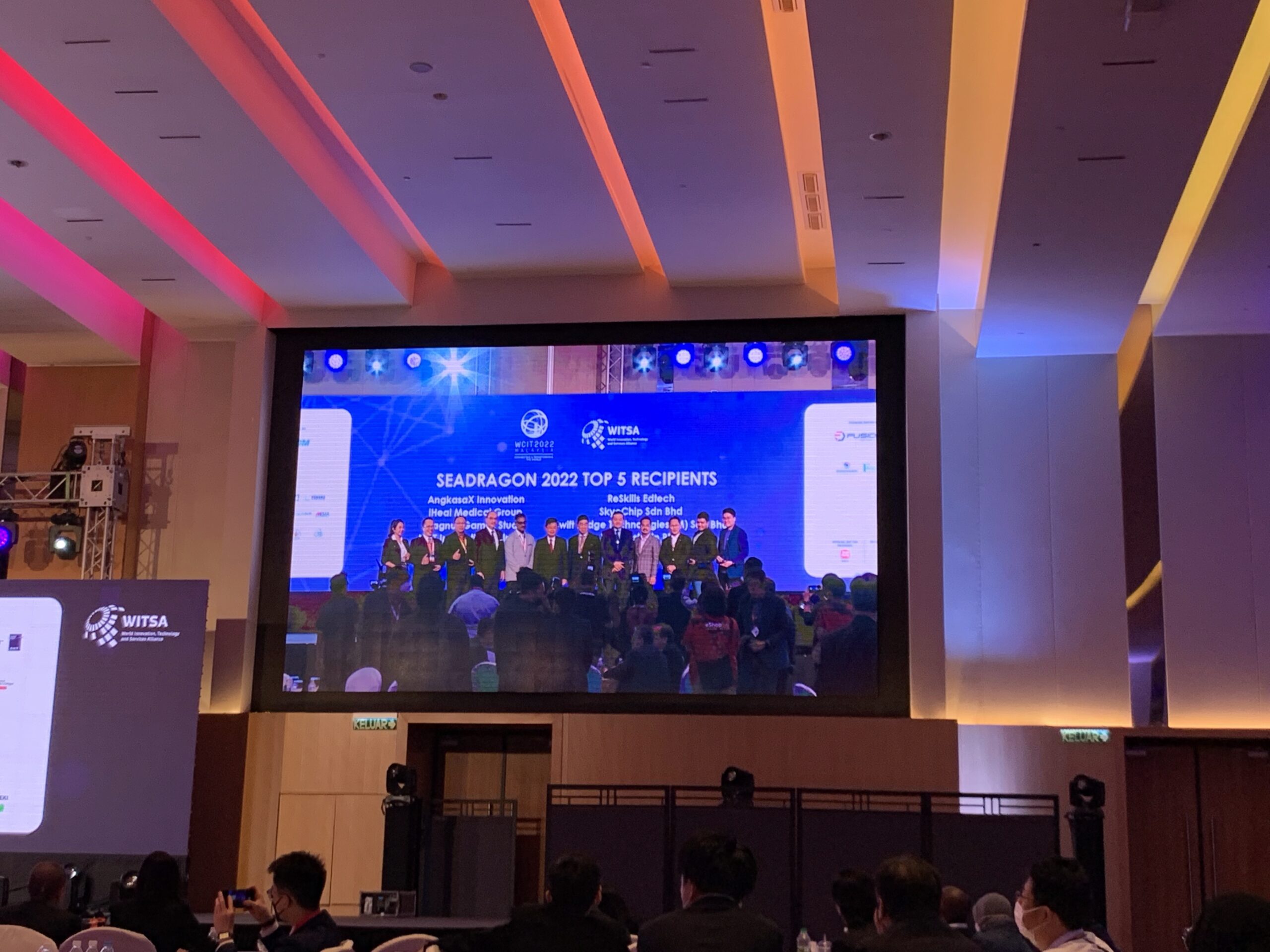 OrangeFIN Asia CEO Robin Hoo takes the stage at WCIT SEADragon 2022 Final Pitching session ...